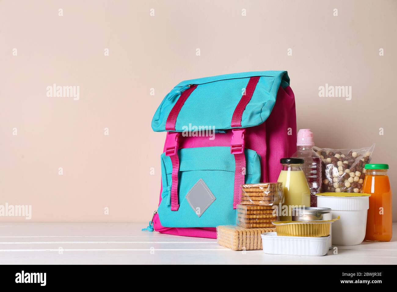 Schoolbag with different products on table. Concept of Backpack Food ...
