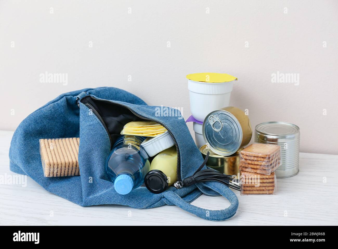 Schoolbag with different products on table. Concept of Backpack Food ...
