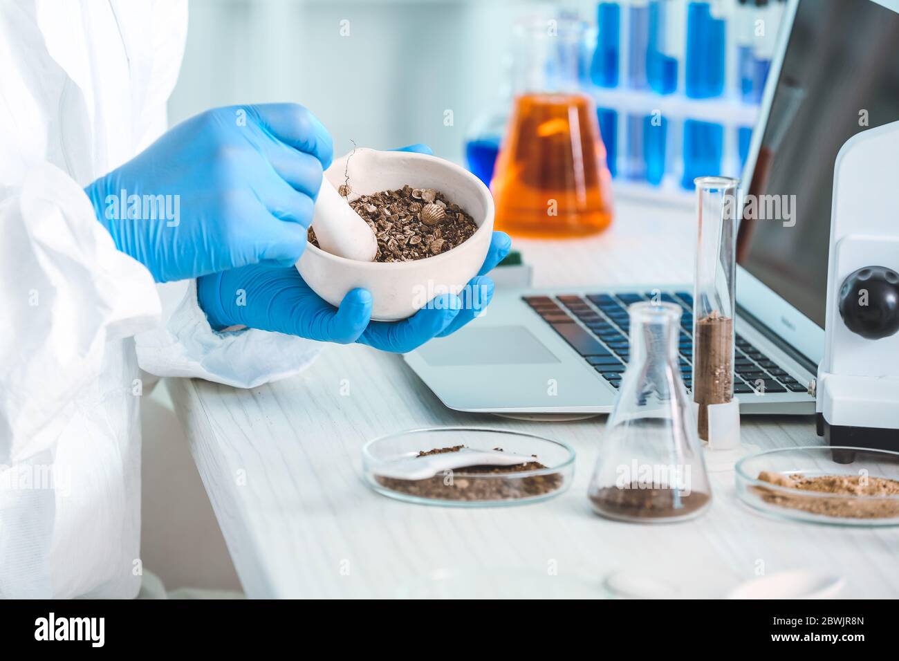 Scientist studying samples of soil in laboratory Stock Photo - Alamy