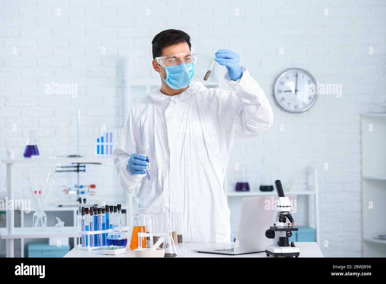 Scientist studying samples of soil in laboratory Stock Photo - Alamy