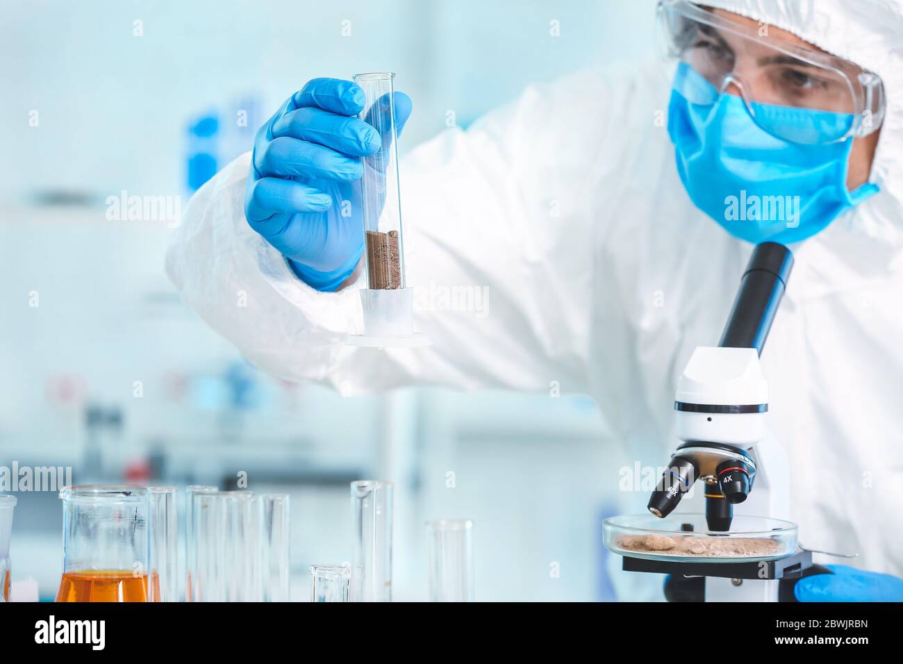 Scientist studying samples of soil in laboratory Stock Photo - Alamy