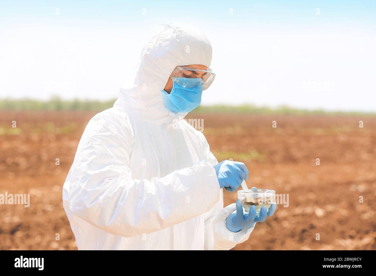 Scientist studying samples of soil in field Stock Photo - Alamy