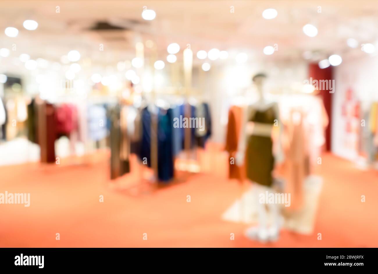 Abstract blurry modern fashion clothes store in a shopping mall for ...