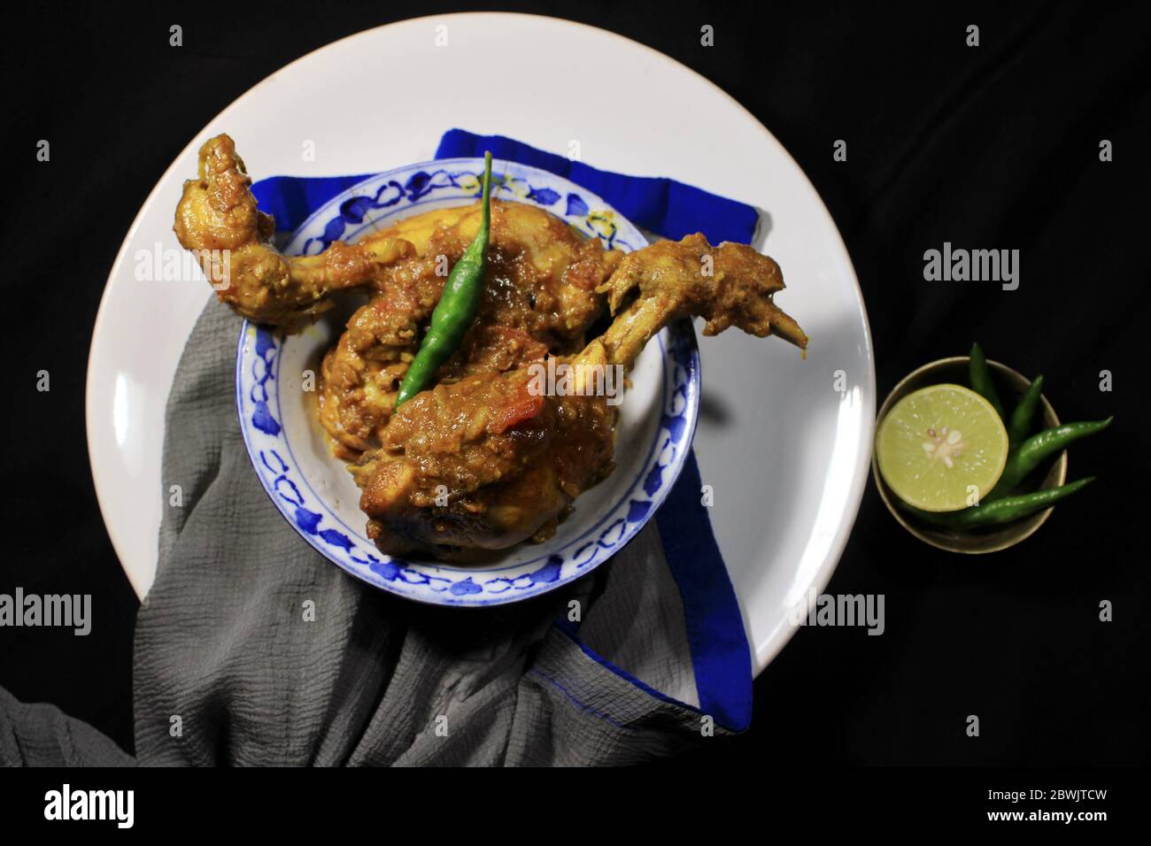 Boiled chicken Curry into white pot. Hot and spicy Chicken Curry with ...