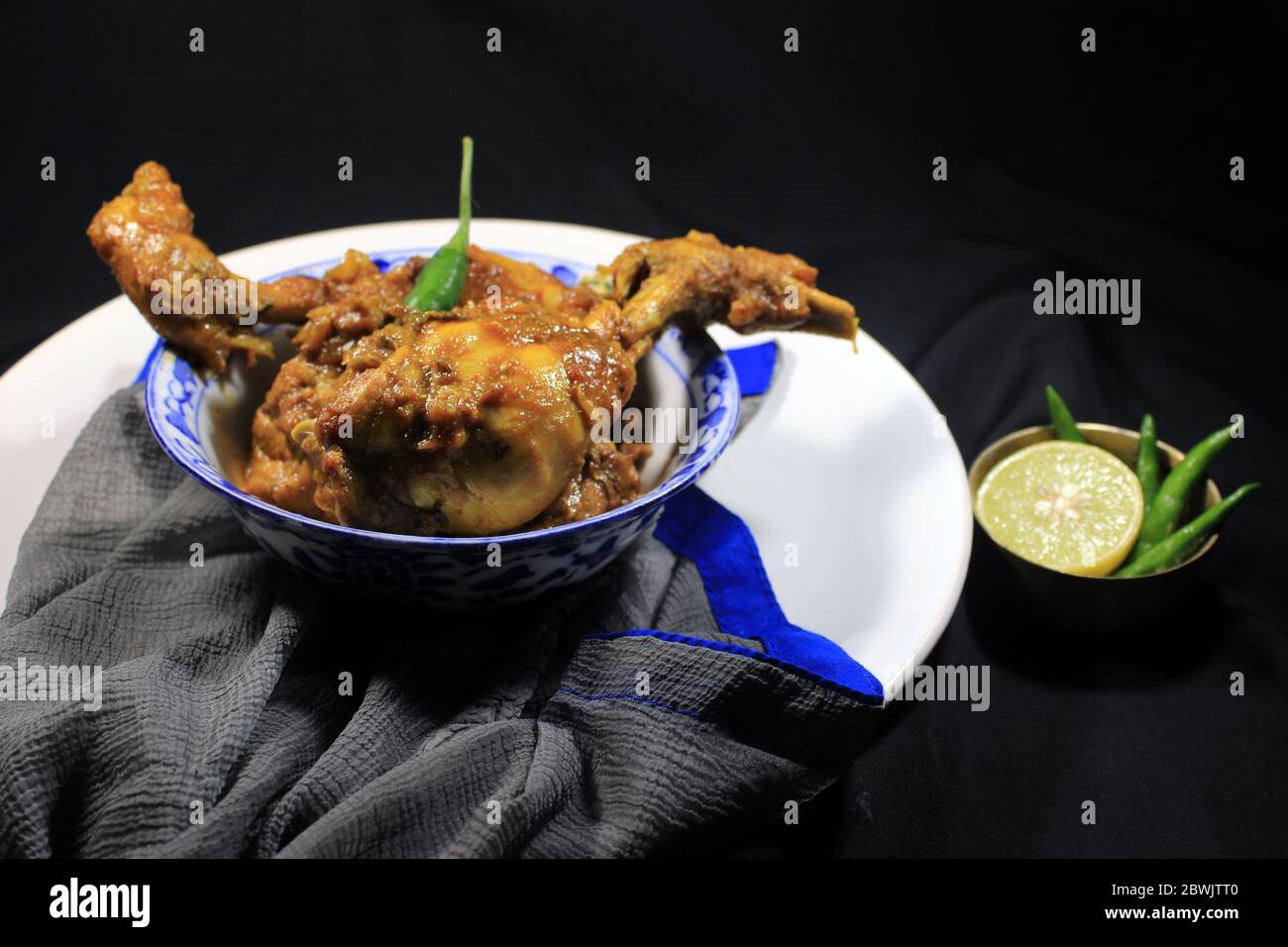 Boiled chicken Curry into white pot. Hot and spicy Chicken Curry with ...
