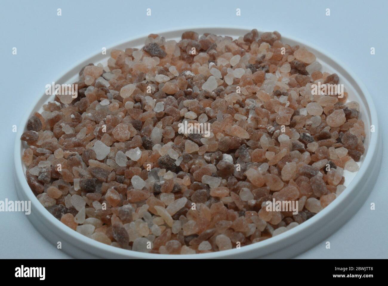 heap of salt isolated on background with clipping path Stock Photo - Alamy