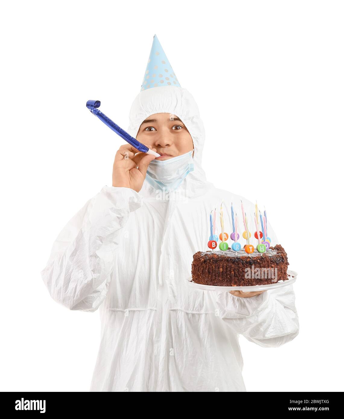 Asian man in biohazard suit and with Birthday cake on white background ...