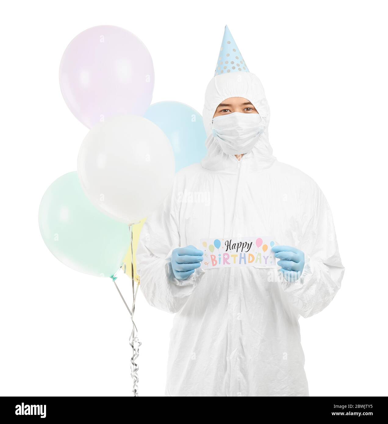 Asian man in biohazard suit, with Birthday balloons and greeting card ...