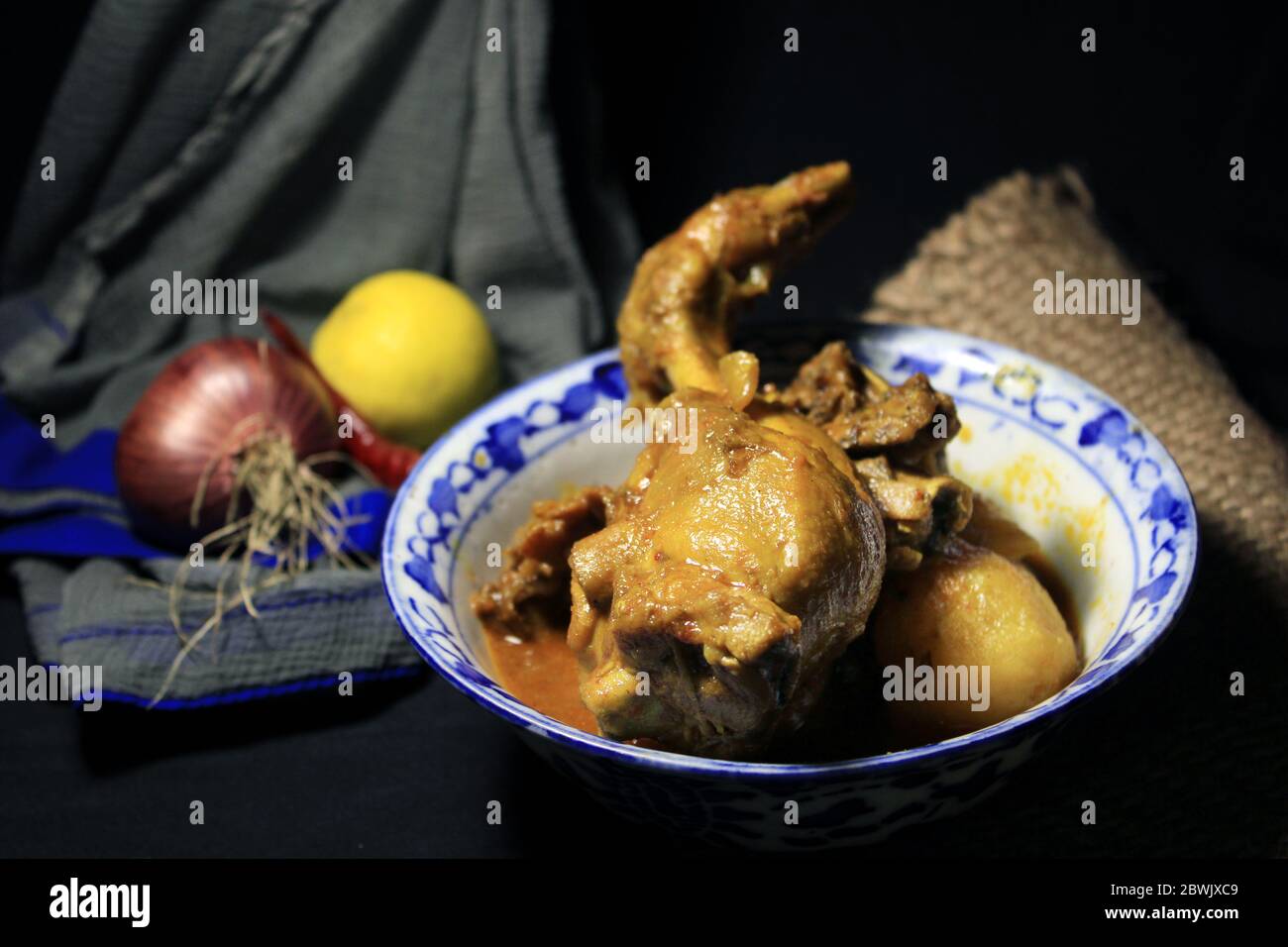 Boiled chicken Curry into white pot. Hot and spicy Chicken Curry with ...