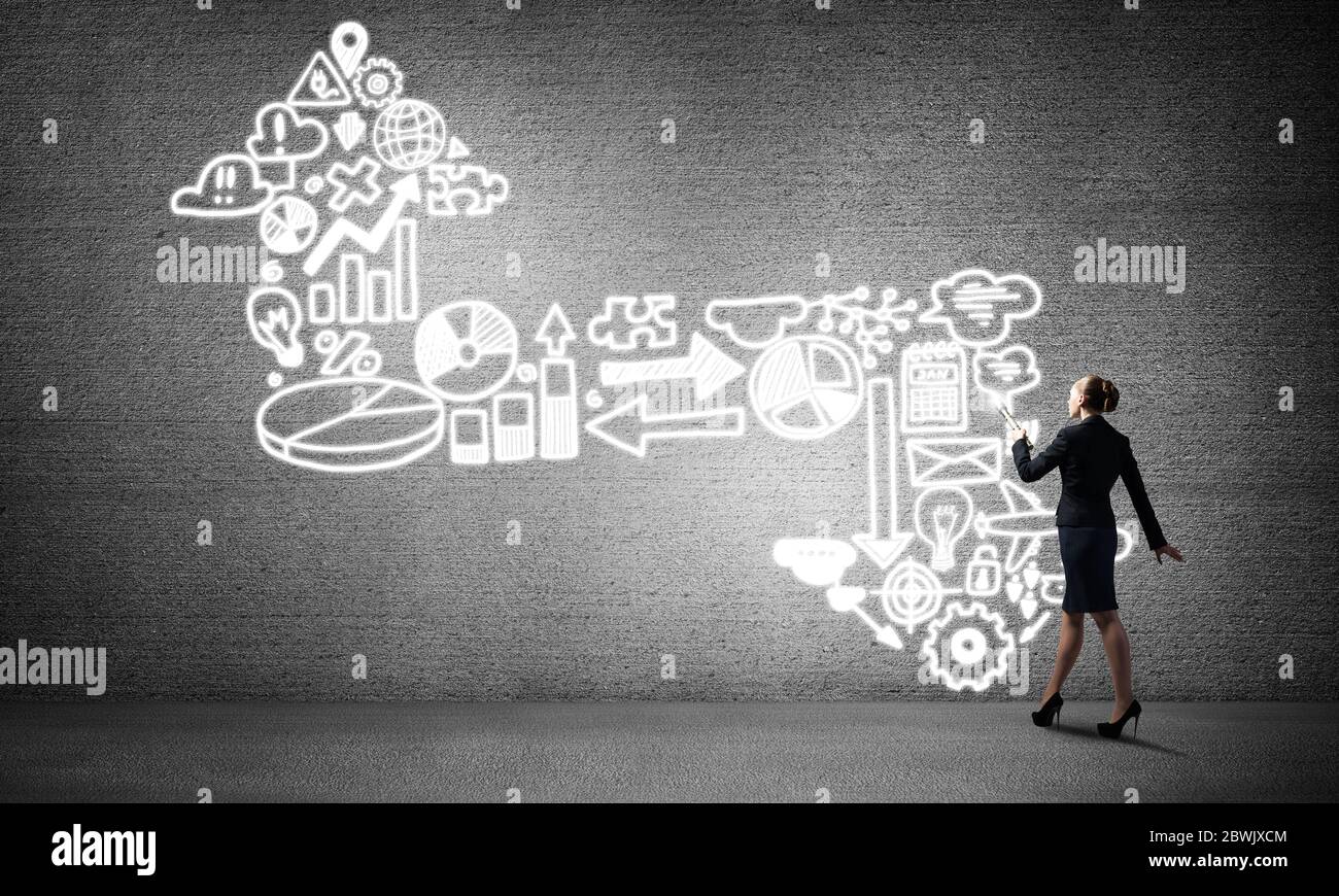 Woman throwing light on her ideas Stock Photo - Alamy