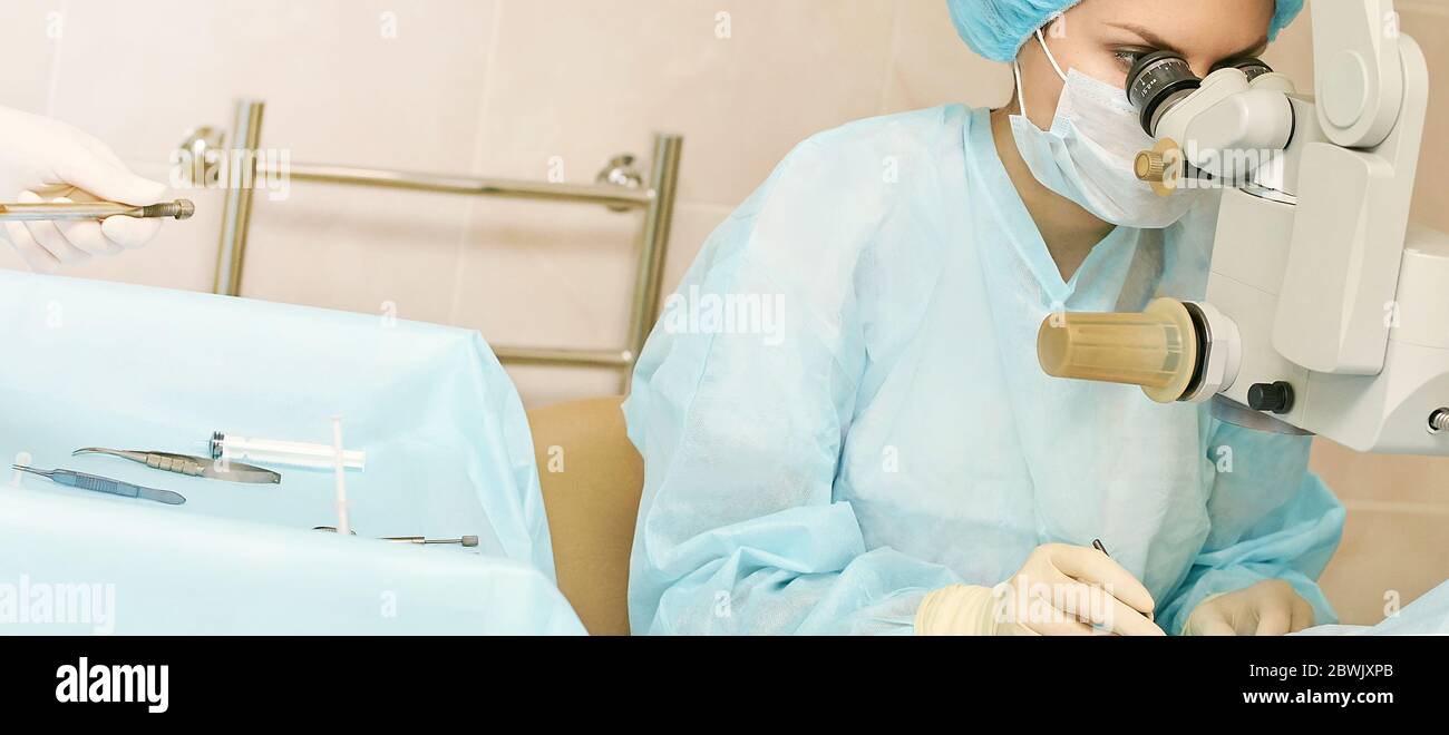 Ophthalmology laser microscope operation. Doctor in clinic. Patient eye ...