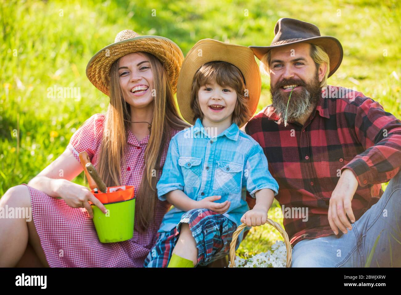 Eco life. Happy family day. Mother father and cute son. Family farm ...