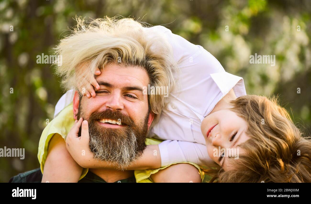 Bearded brutal man good father. Dad and son. Little son. Spring walk ...