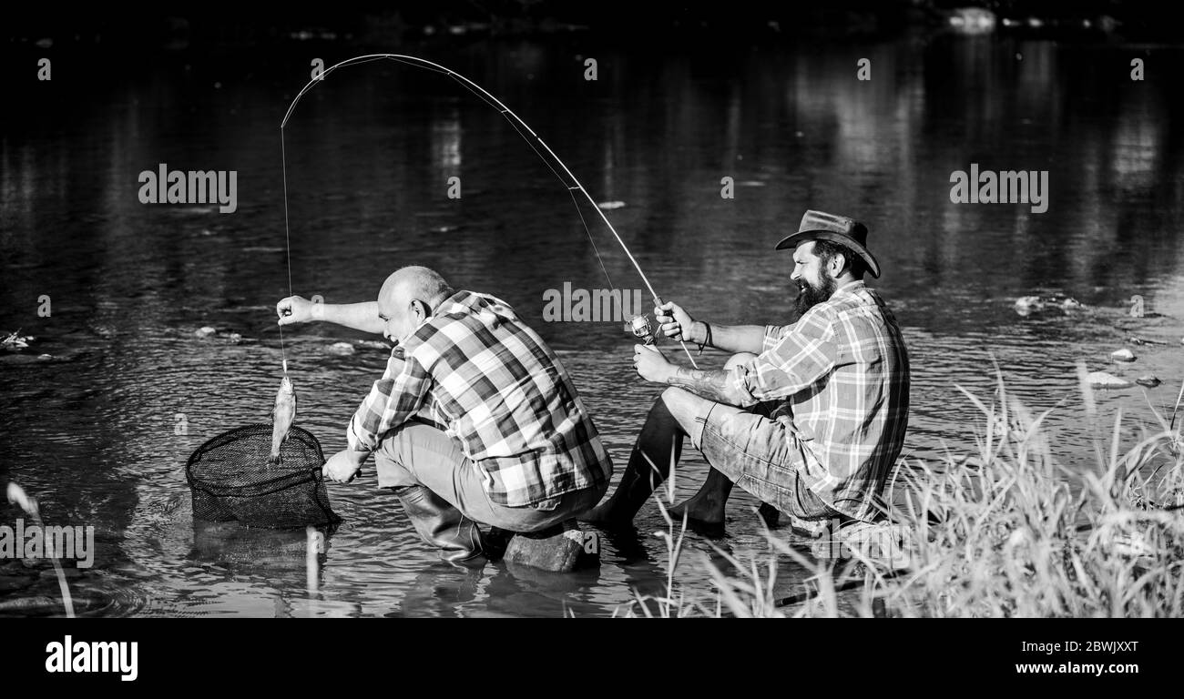 Black market caviar. Poachers fishing. Trap for fish. Men sit at ...