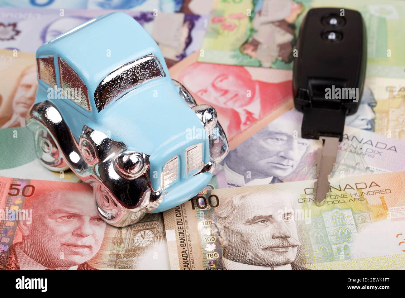 Car with key on a Canadian dollars background Stock Photo - Alamy