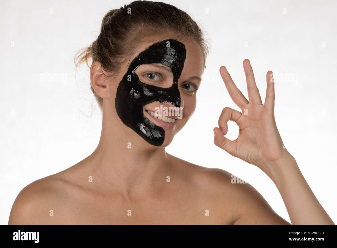 Happy beautiful girl with acne smiling on a white background in a ...