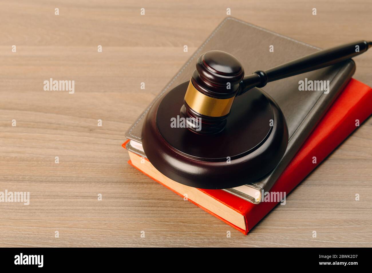 Judge gavel and laws books on a wooden table. The concept of law ...