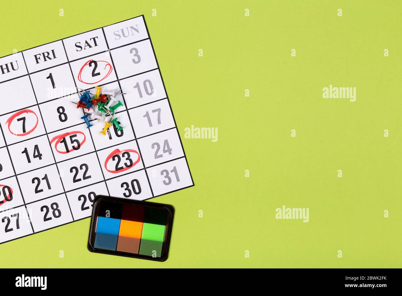 Open calendar on the table with green background, planning a business ...