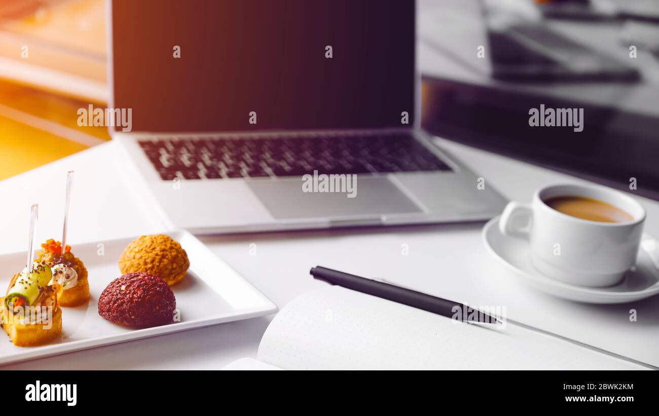 Business lunch in office,food snacks coockies on white wooden desk near ...