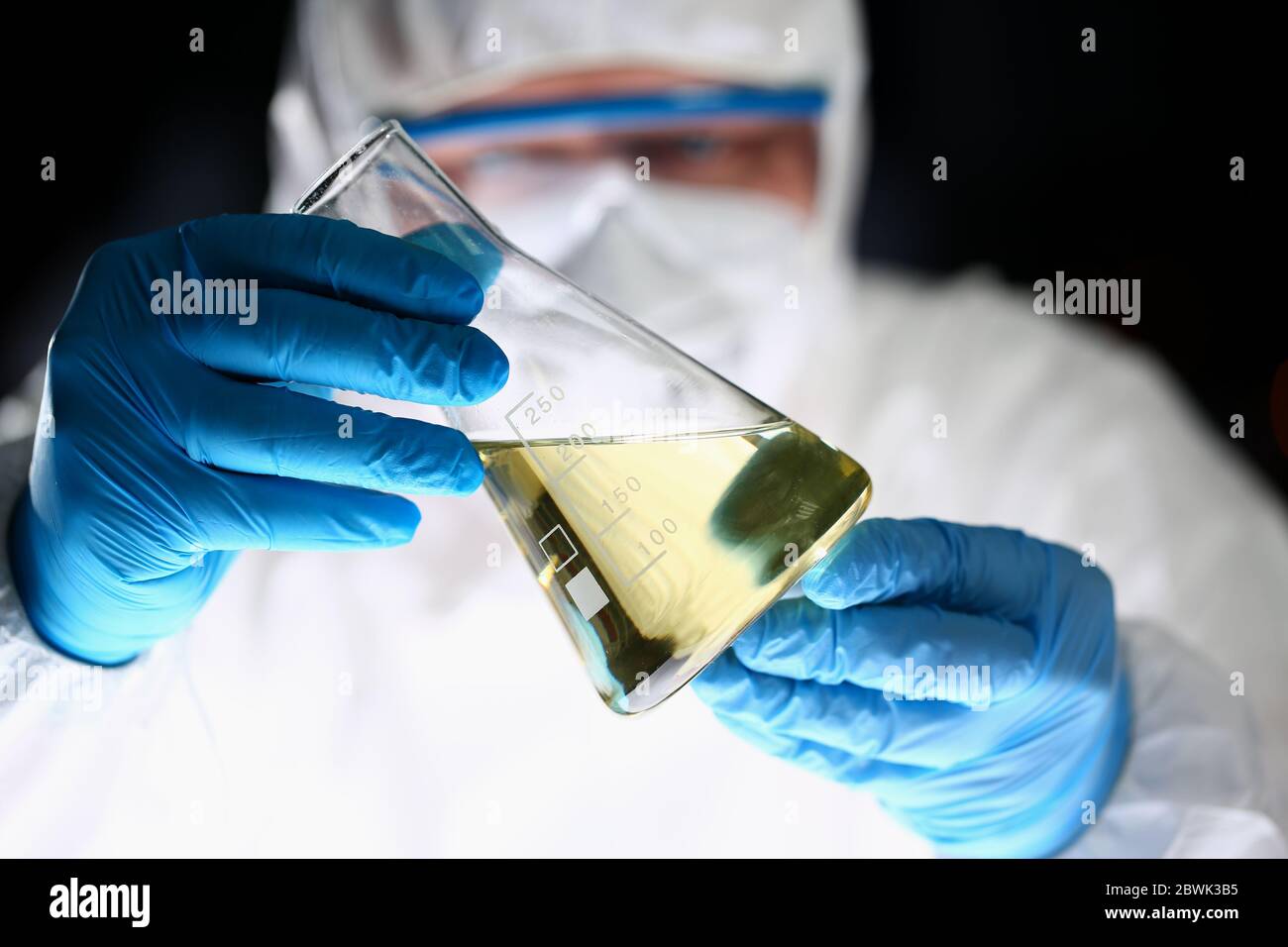 Focused photo on male hands that holding flask Stock Photo - Alamy