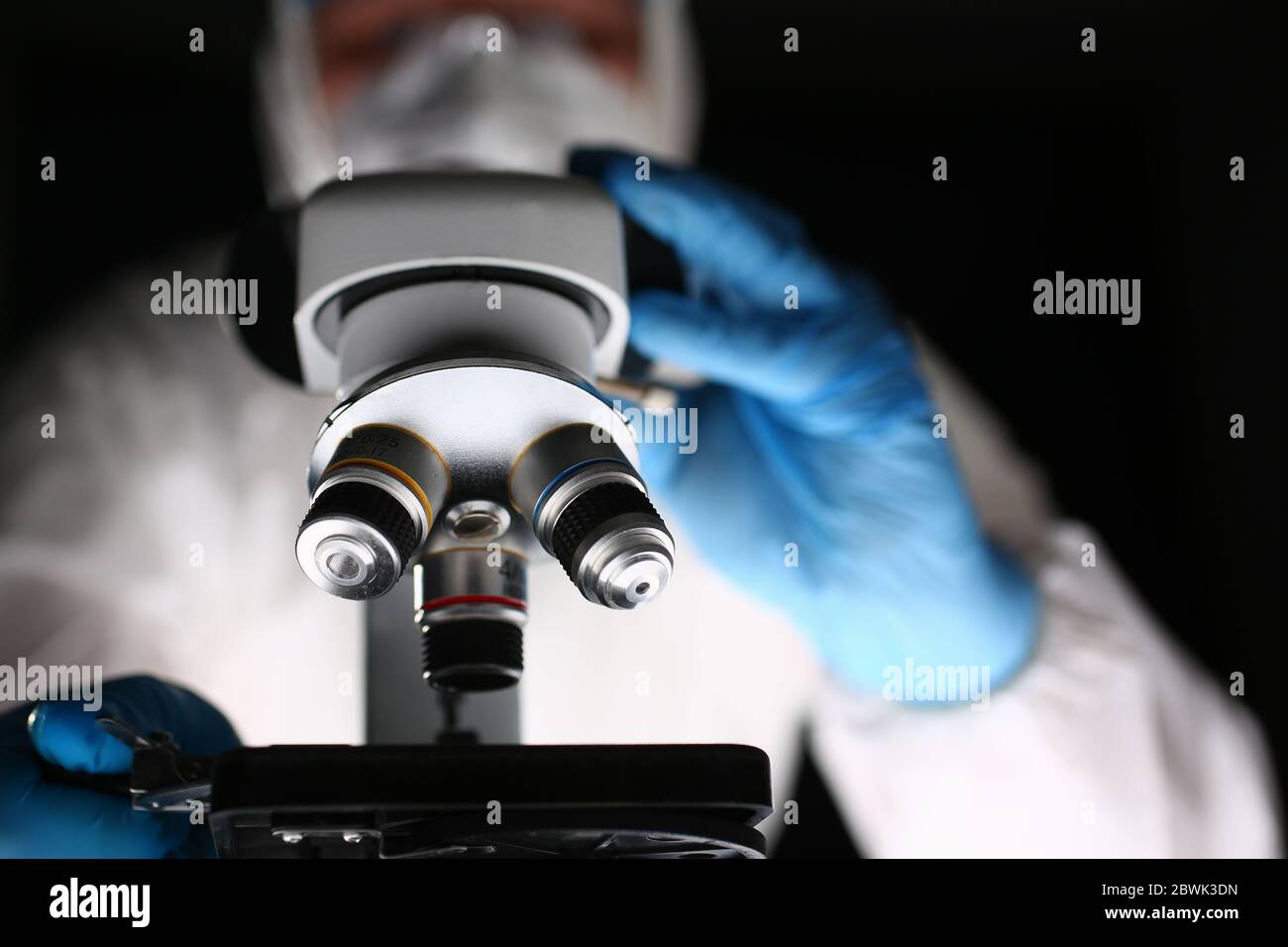 Close up of researcher that working with microscope Stock Photo - Alamy
