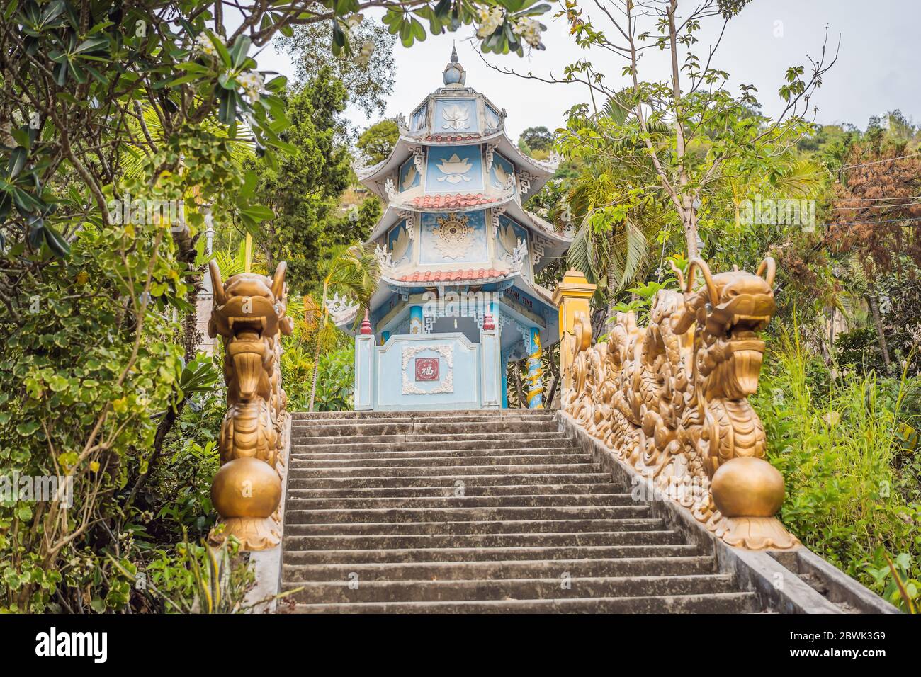 Vietnamese small Buddhist temple with dragons in the forest Stock Photo ...