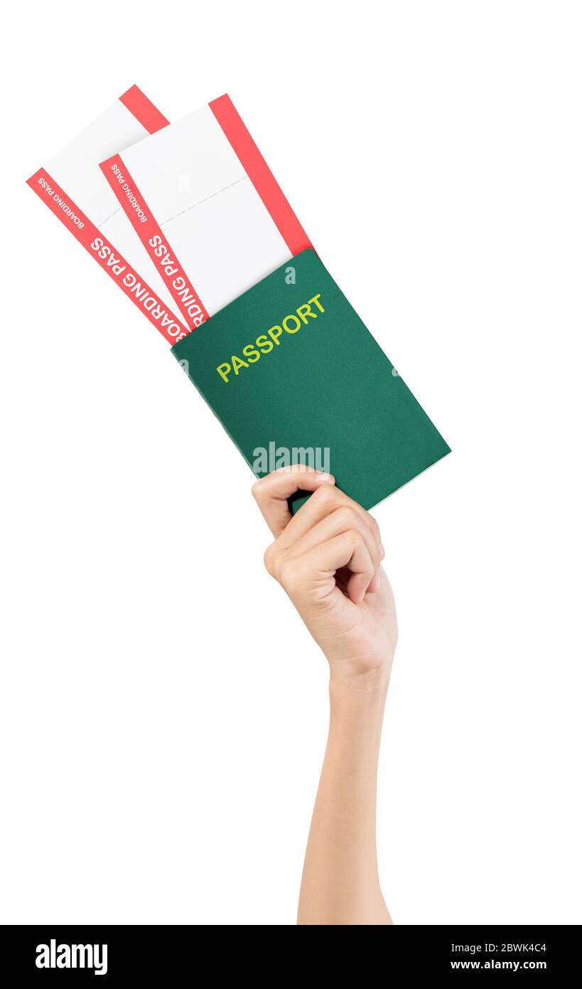 Hand holding ticket and passport isolated over white background Stock ...