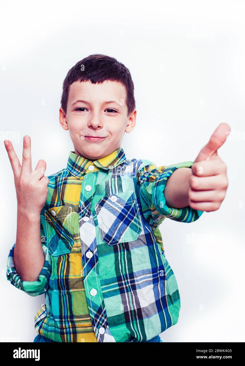 little cute real boy on white background gesture smiling close up ...