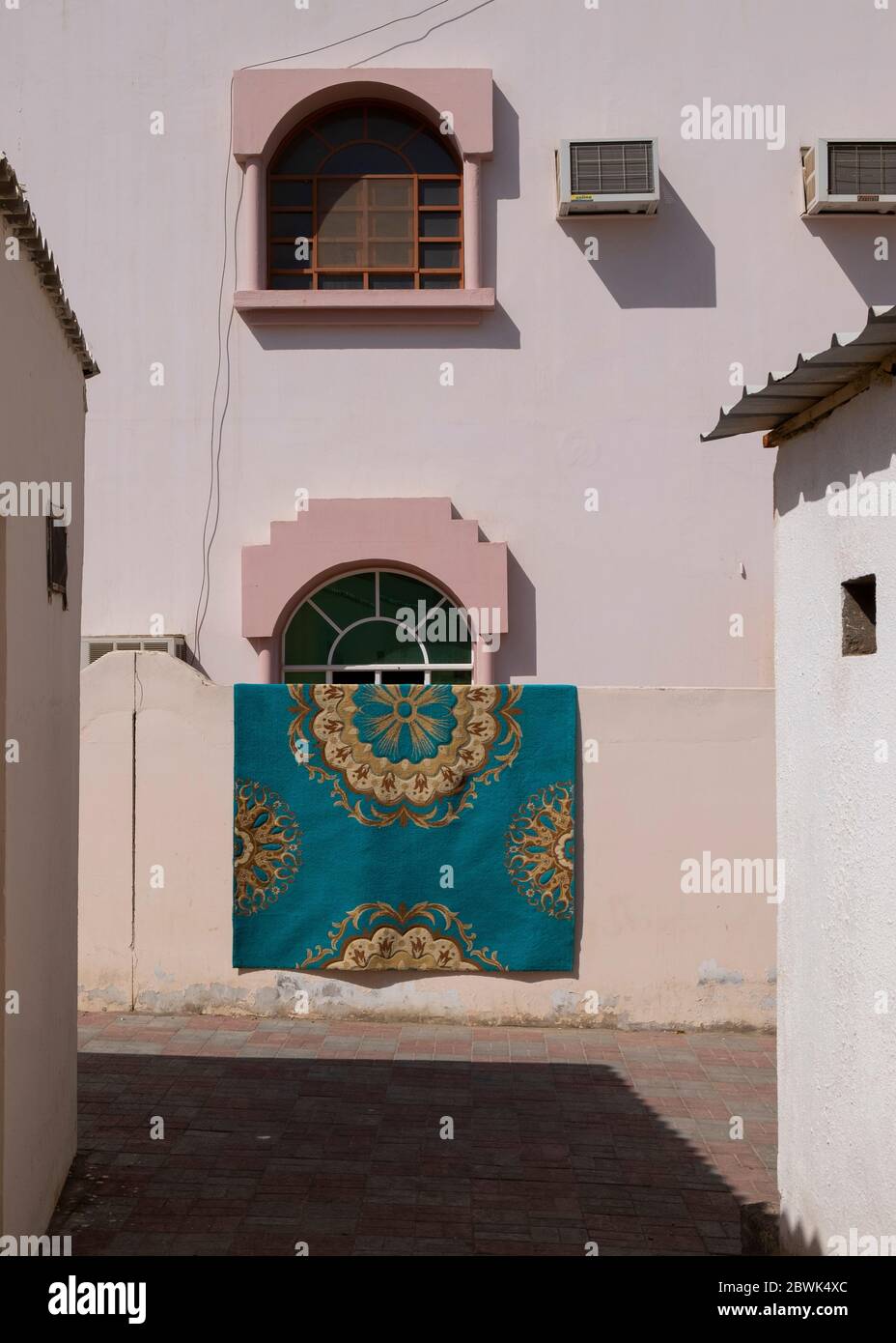 Carpet on a wall drying in the sun, Muscat, Sultanate of Oman Stock ...
