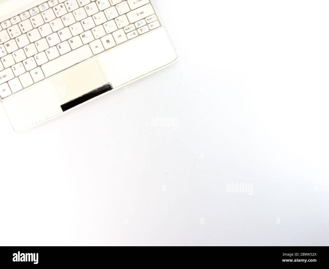 Top view of white laptop closeup on white background Stock Photo - Alamy