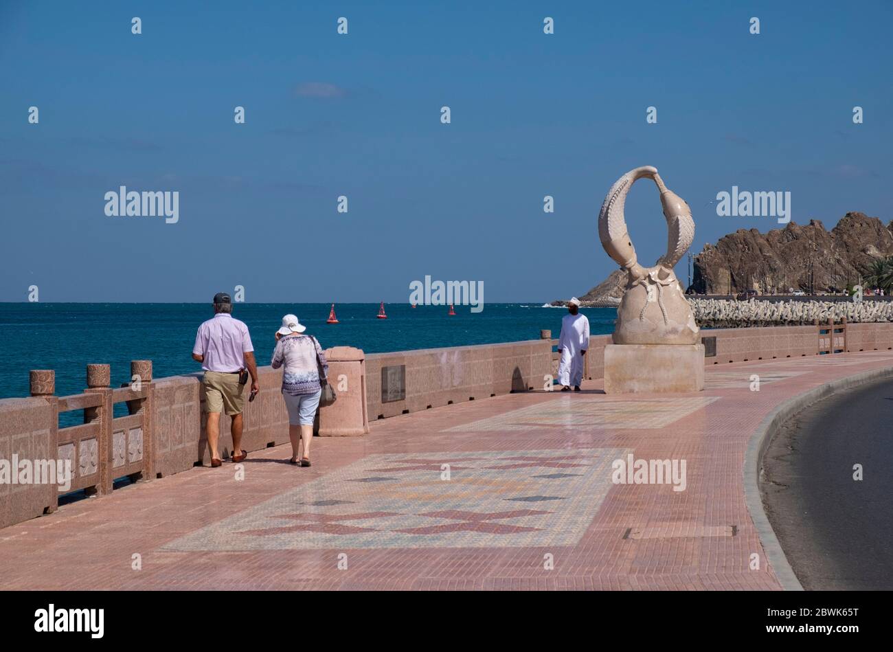Tourists walking on the Mutrah Corniche, Muscat, Sultanate of Oman ...