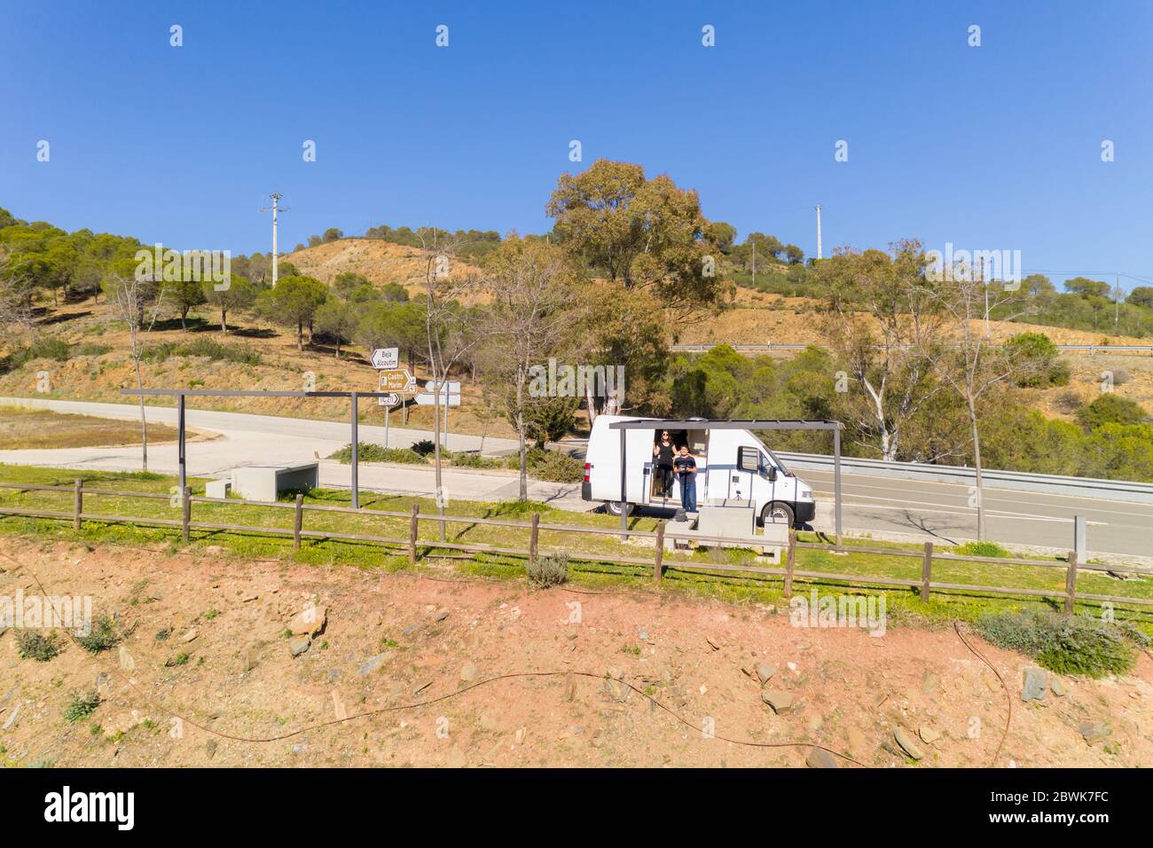 Couple living the van life inside camper van on a nature landscape ...