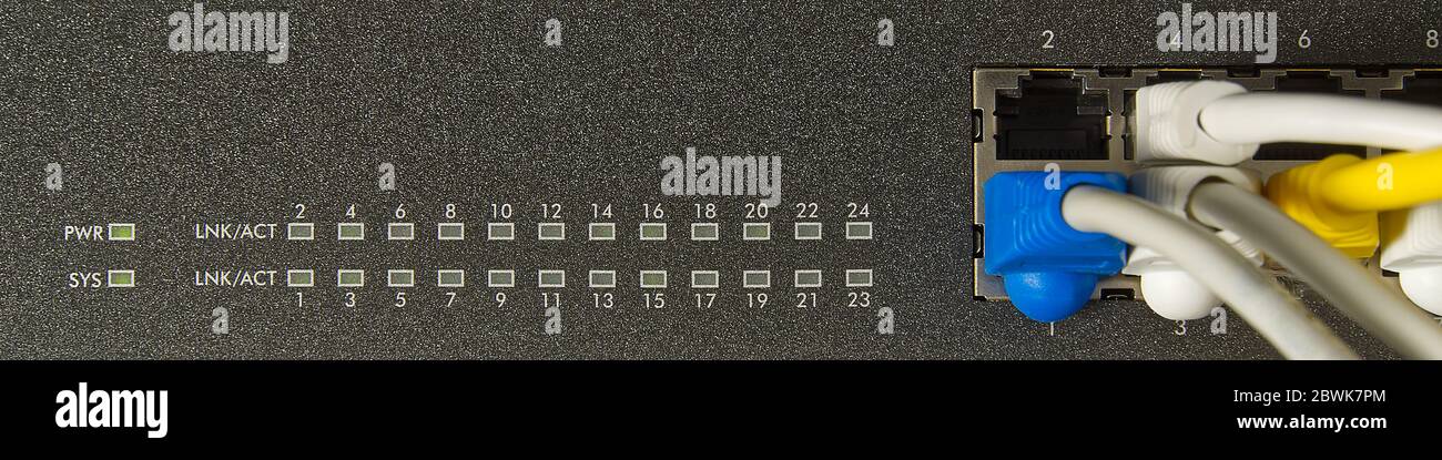 Network switch and ethernet cable in rack cabinet. Network connection ...
