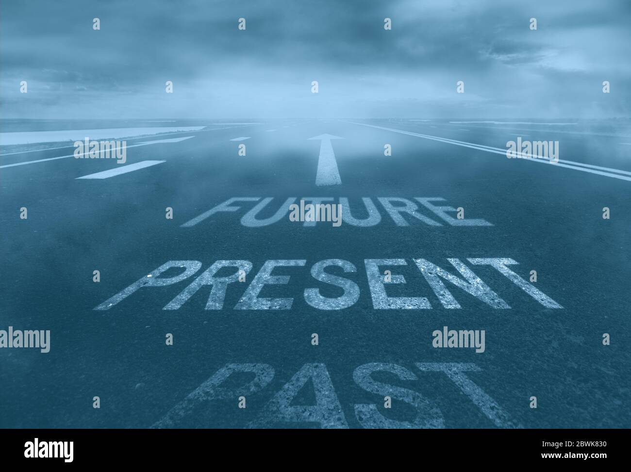 The concept of the past, present, future. Desert road in the mist Stock ...