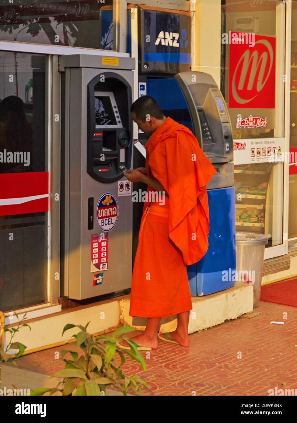 The monk and ATM in Vientiane city, Laos Stock Photo - Alamy