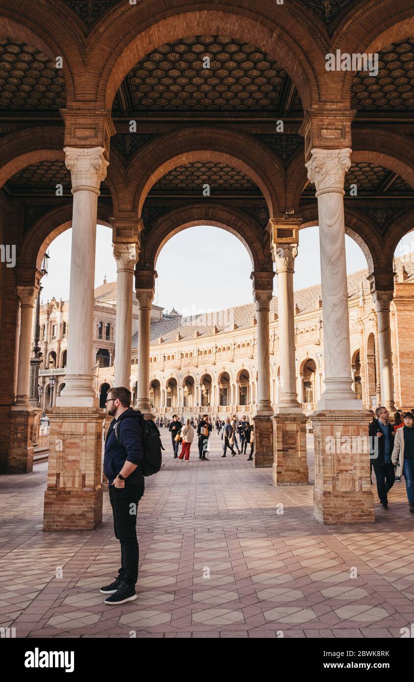 Seville, Spain - January 17, 2020: People walking amongst arches on ...