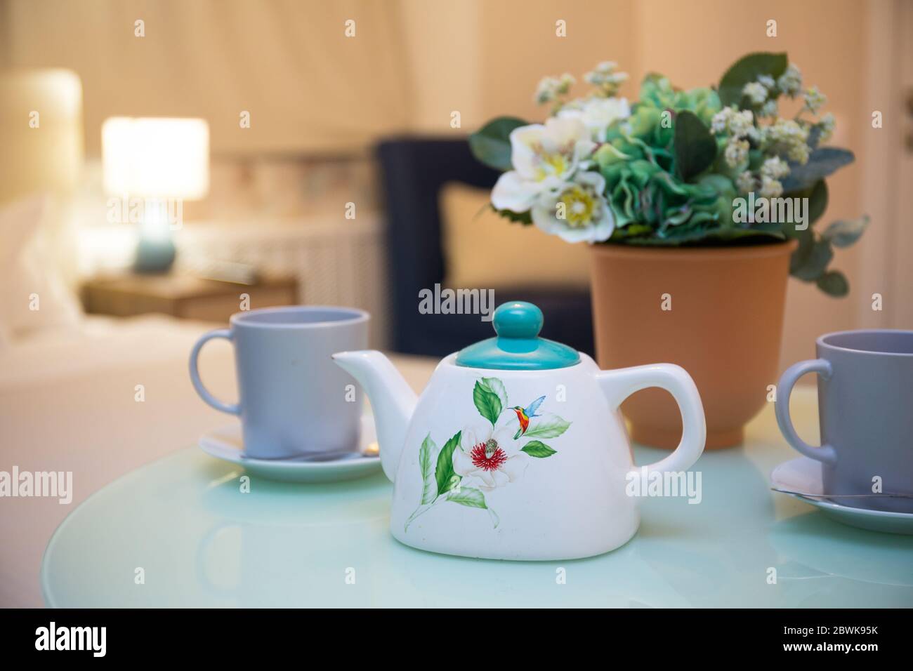 Scene with table served for tea ceremony with natural flowers Stock ...