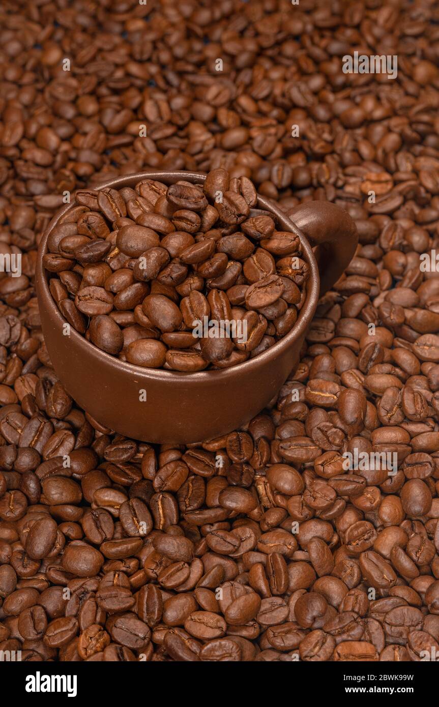 coffee cup with coffee beans on a background of coffee beans Stock ...