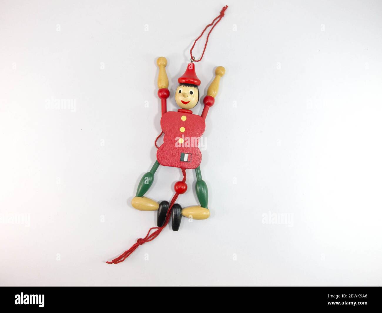 puppet Old wood Green and red puppet dolls On a white background Stock ...