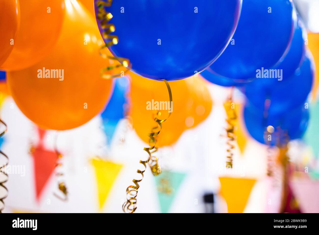 colourful balloons, blue, Orangeand triangle flags isolated. Party and ...
