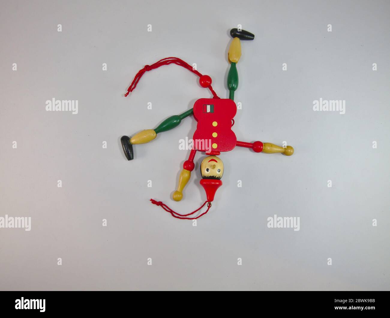 puppet Old wood Green and red puppet dolls On a white background Stock ...