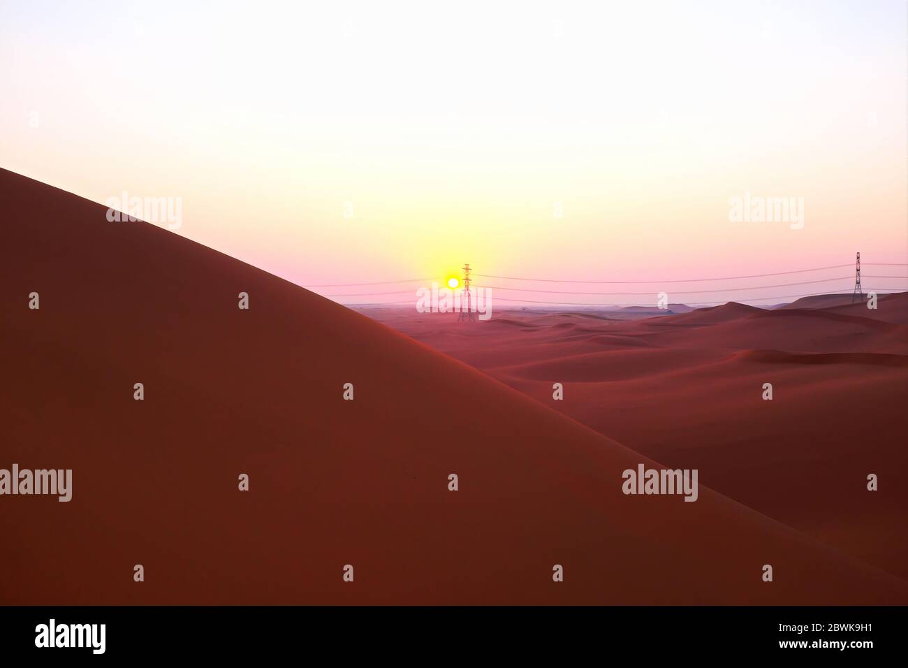 Pastel colored sunrise on the red sand dunes of the Al Dahna Desert in ...