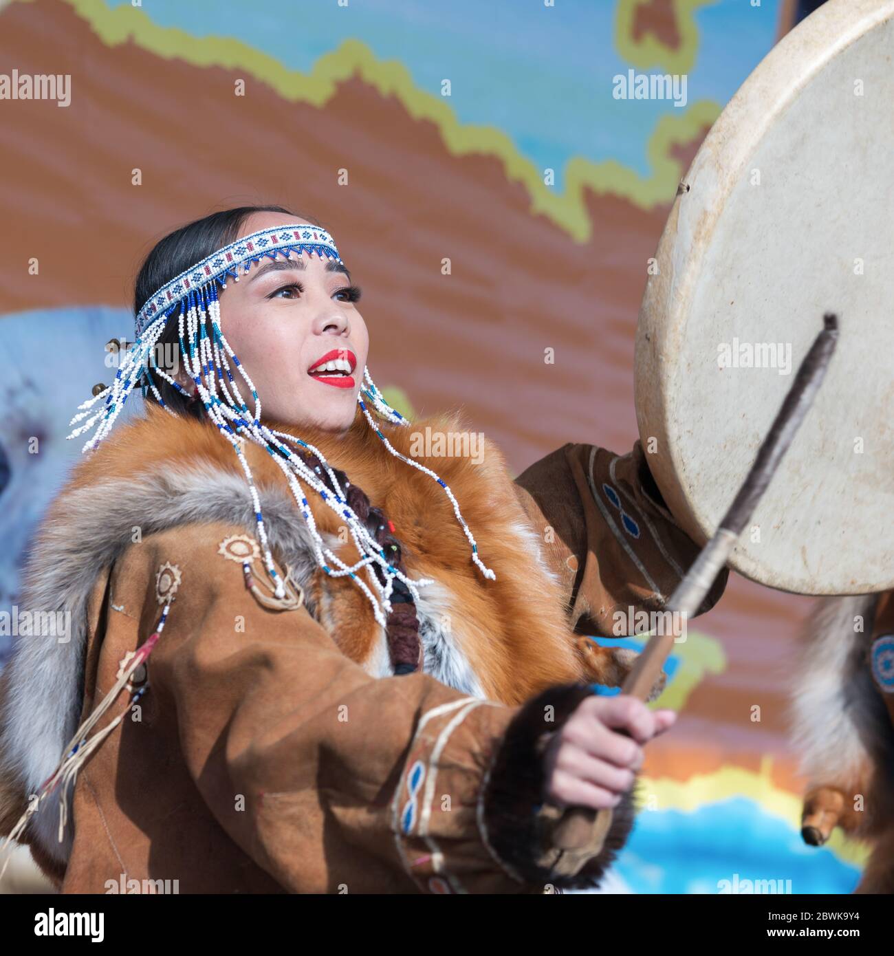 Woman in national clothing indigenous inhabitants Kamchatka dancing ...
