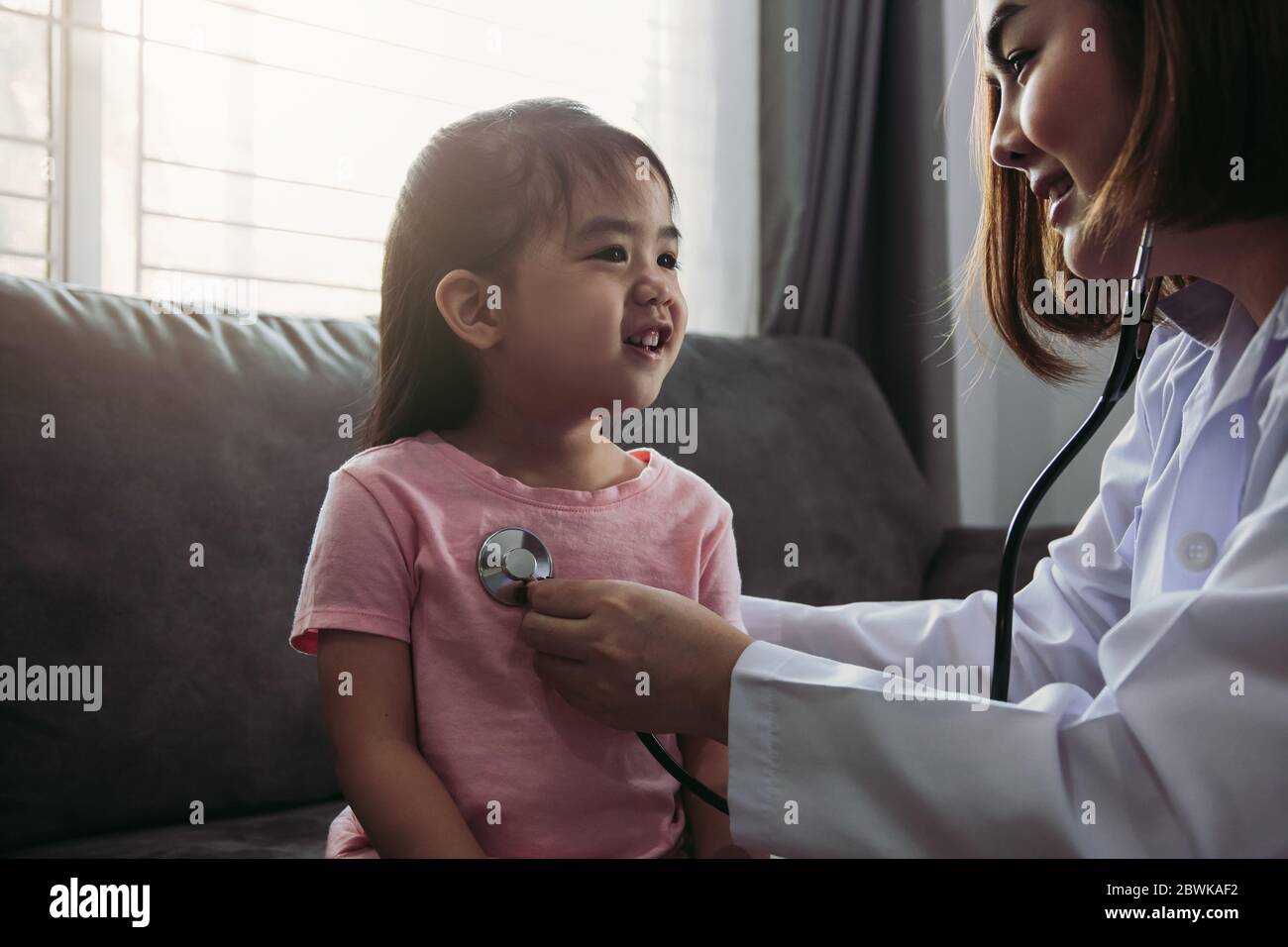 Confident asian woman healthcare professional visit her patient using a ...