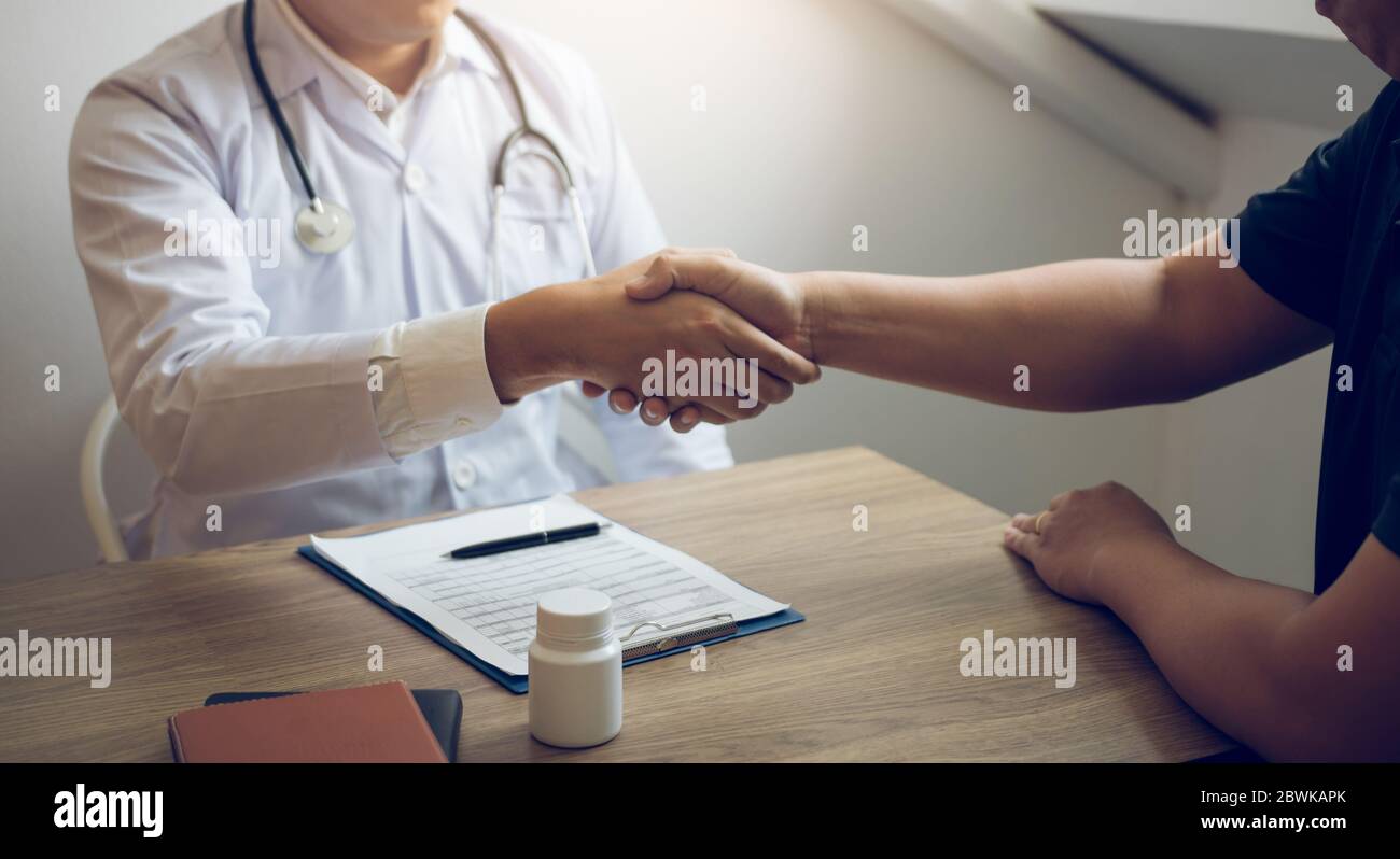 Asian patient doctor handshake hi-res stock photography and images - Alamy