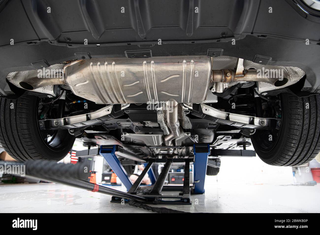 New modern car chassis. Car on jack in car service Stock Photo - Alamy