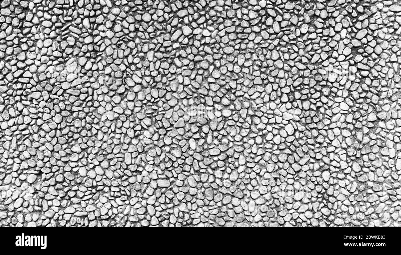 Gray stones and pebbles on wall as background texture header Stock ...