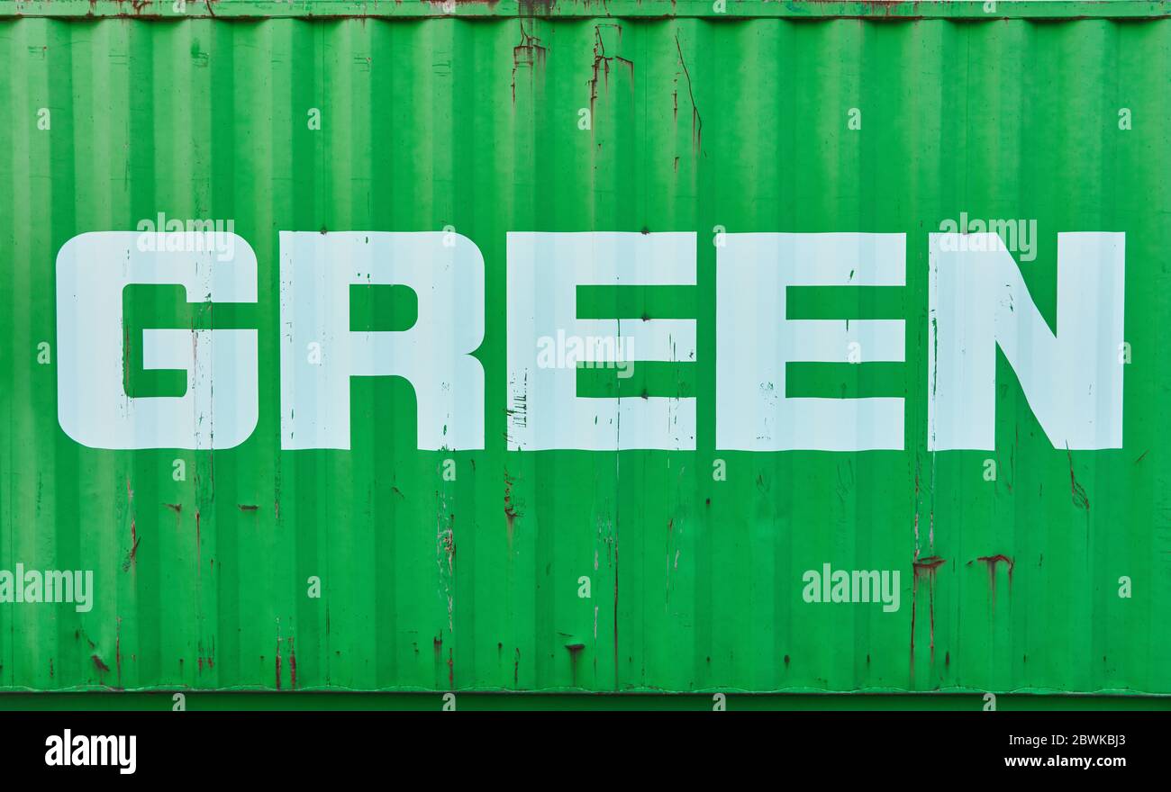 Green text on container as sustainability and environmental protection ...
