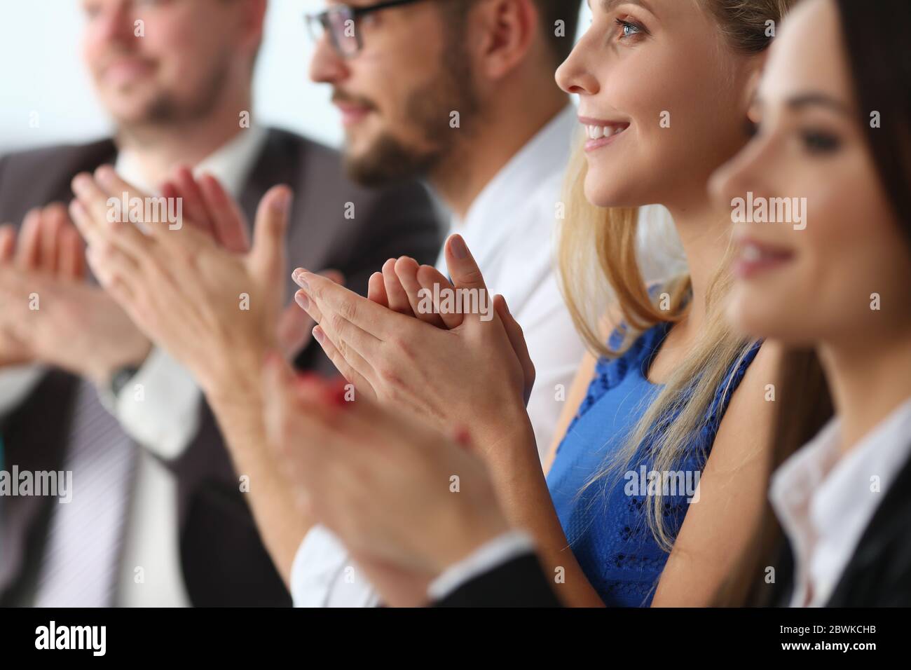 Positive delighted people being grateful for conference Stock Photo - Alamy