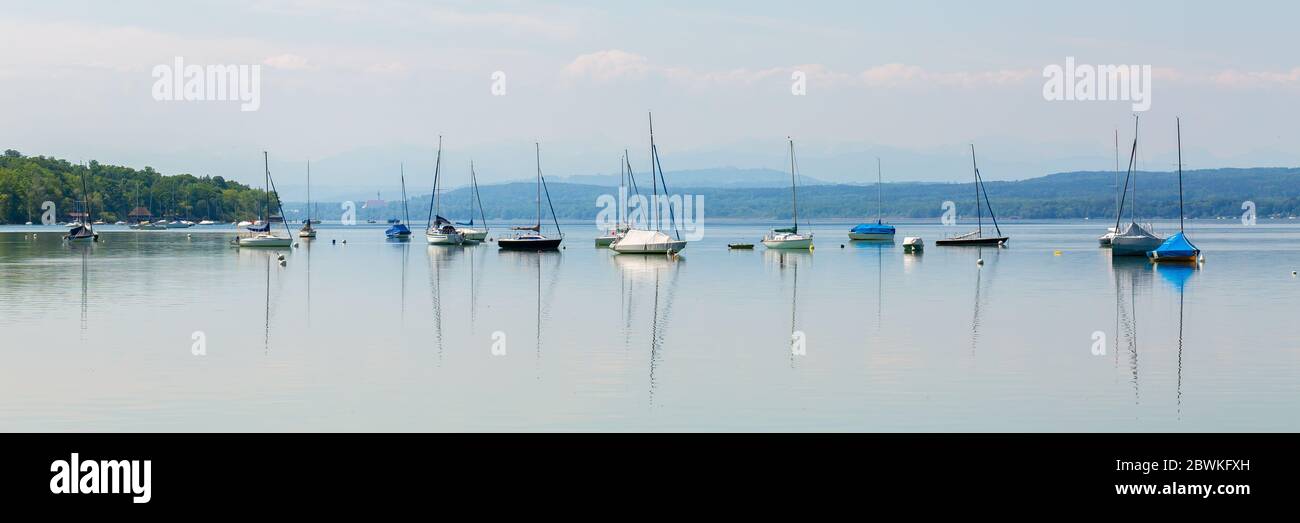 Panorama with anchoring sailboats and small yachts at Ammersee. Lake ...